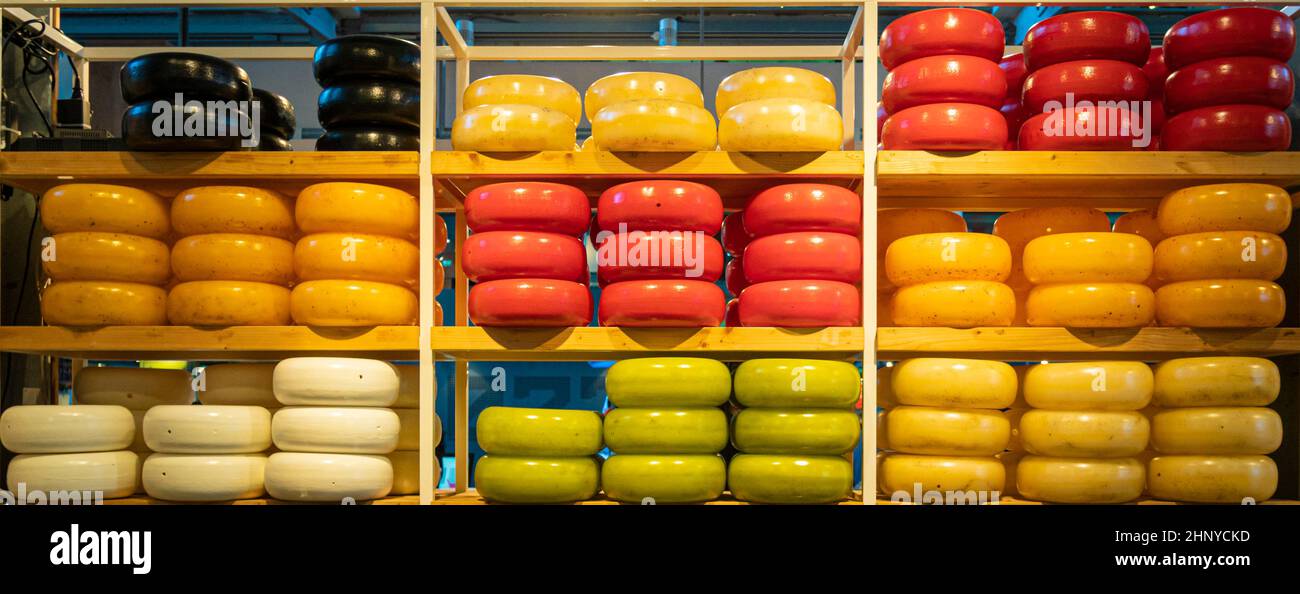 A colorful selection of large round dutch cheeses on display Stock ...