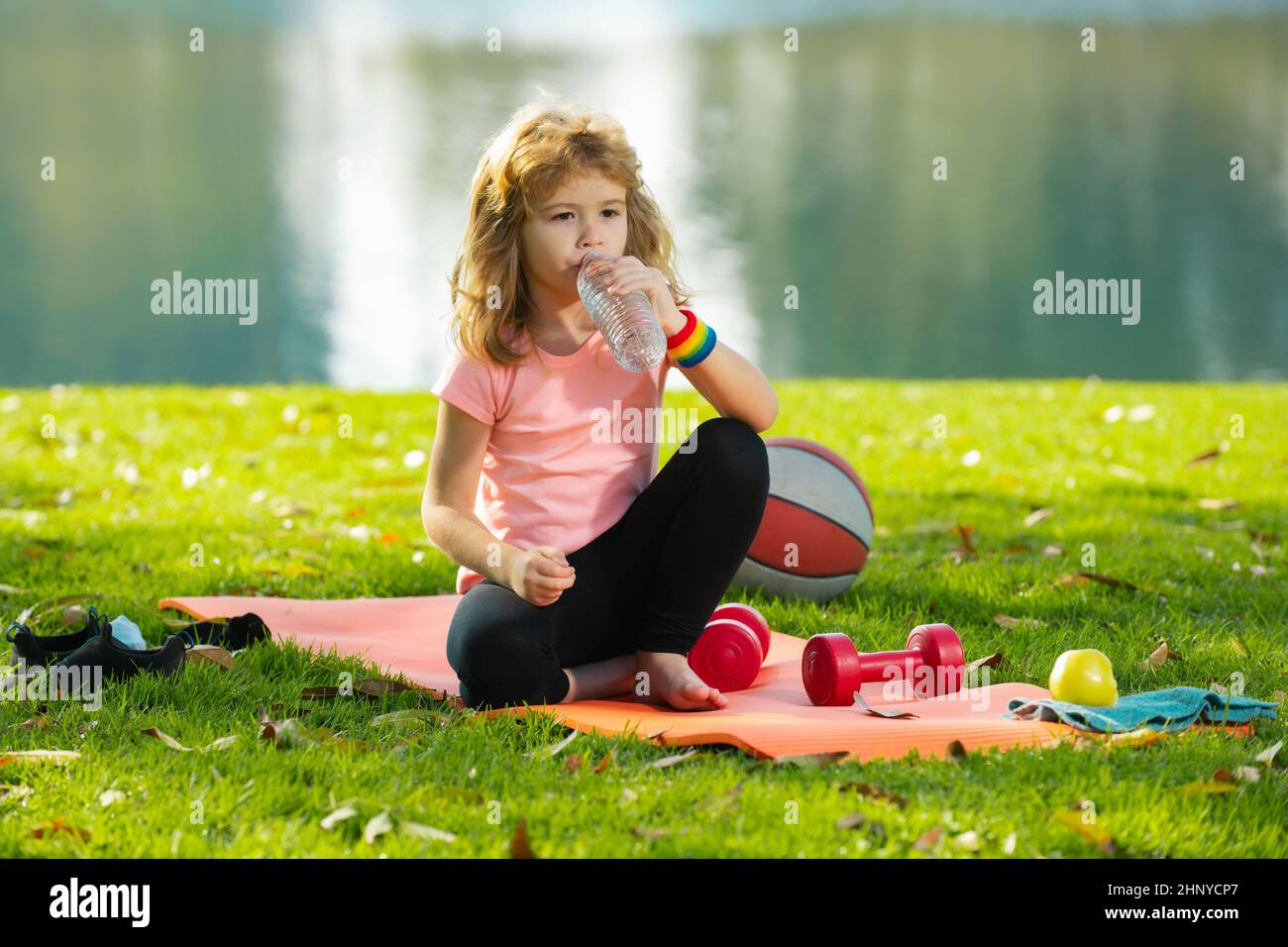 Sport kids boy. Kids relax on sport mat after sport exercises outdoor ...