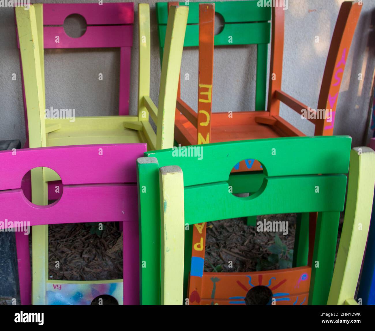 colorful chairs gathered at the end of summer Stock Photo - Alamy