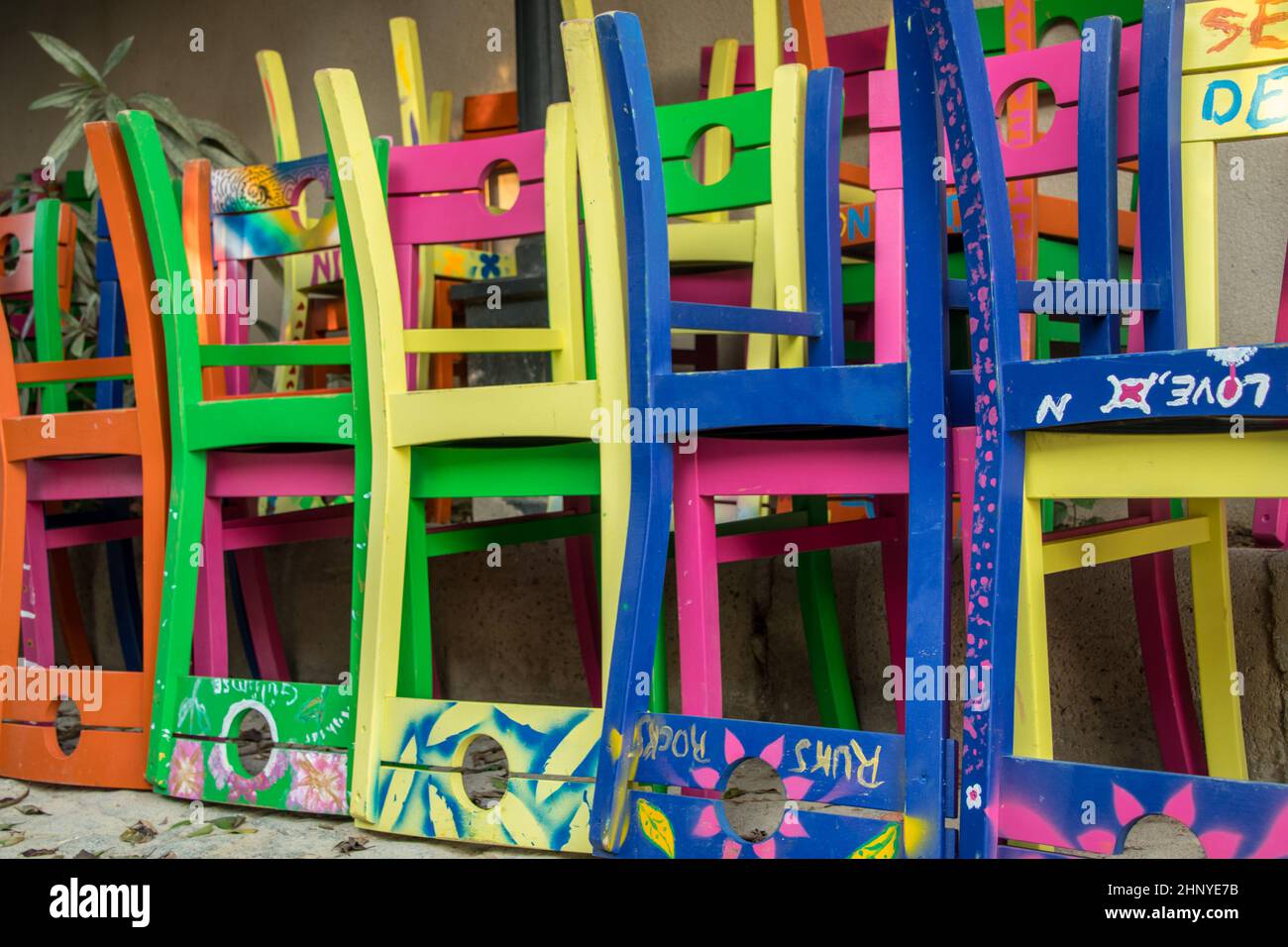 colorful chairs gathered at the end of summer Stock Photo - Alamy