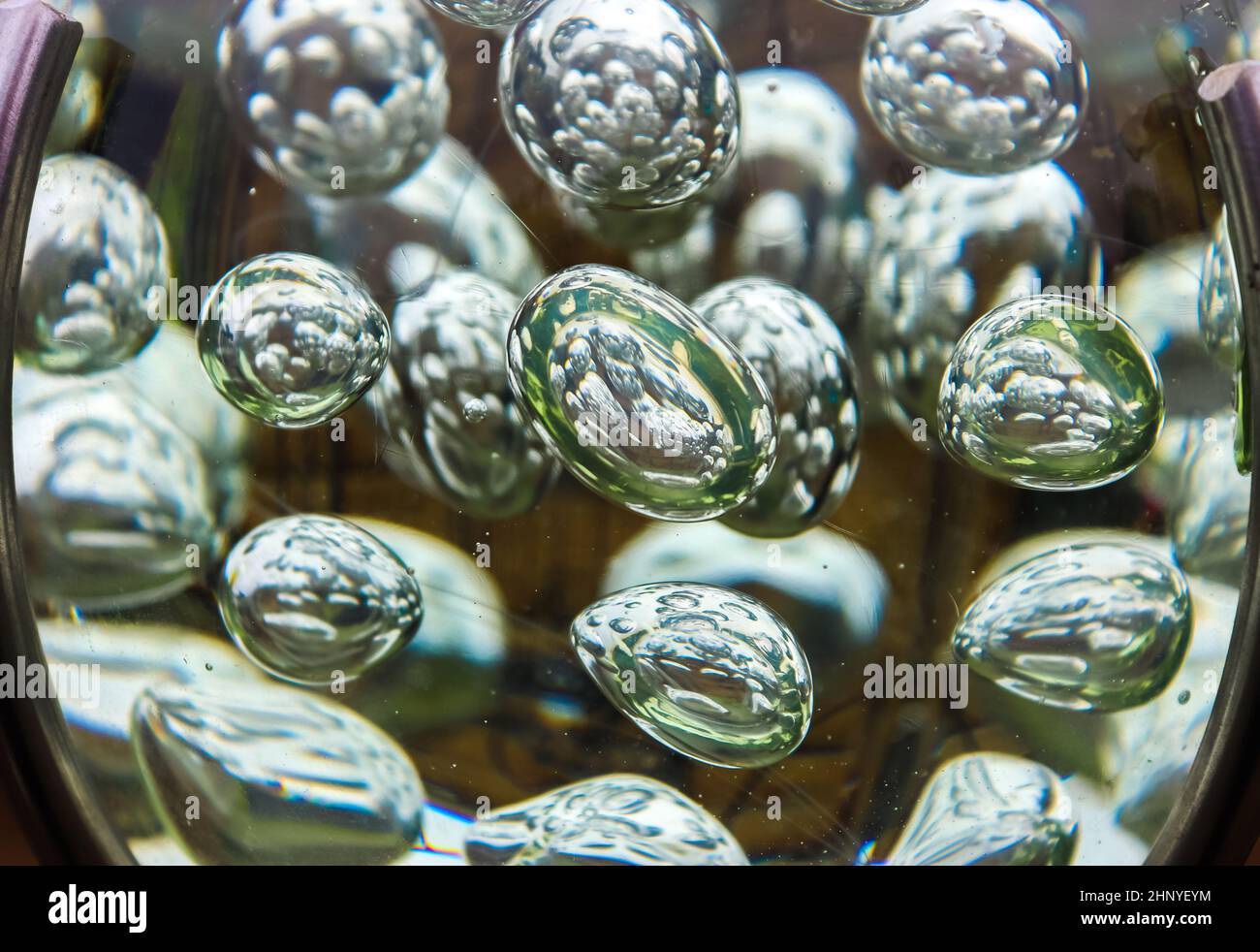 Close-up view of a glass sphere with air pockets Stock Photo - Alamy