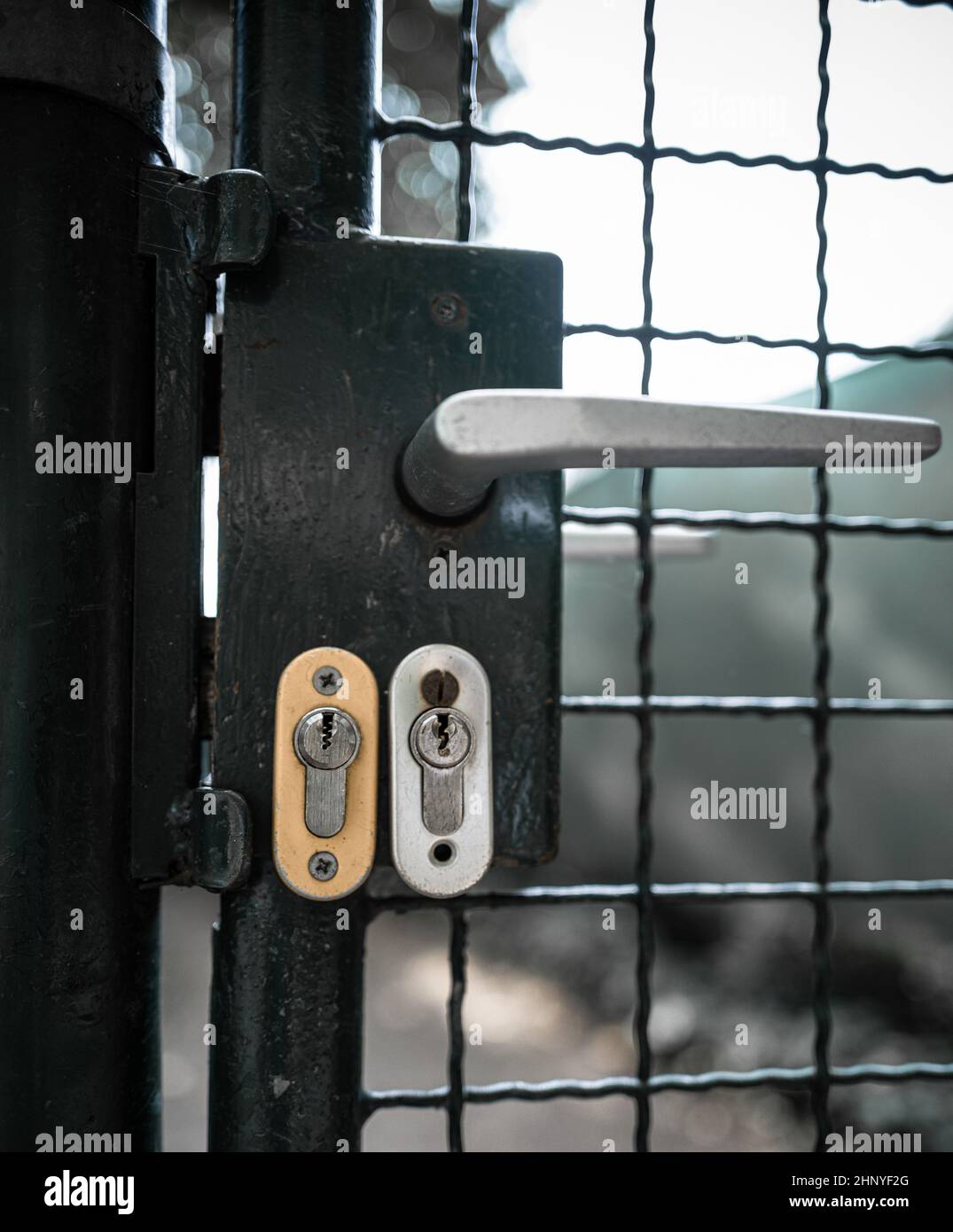 An interesting door with a double lock system Stock Photo - Alamy