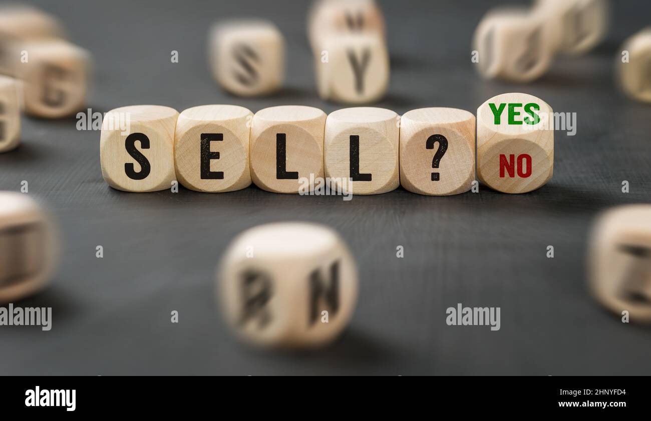Letter dice with the word Sell Yes or No Stock Photo - Alamy