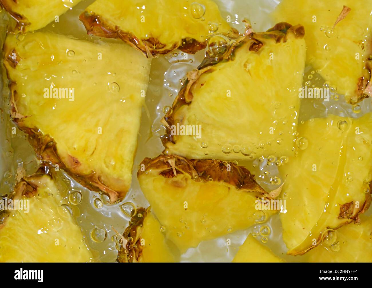 Close-up fresh slices of yellow pineapple on white background. Slices ...