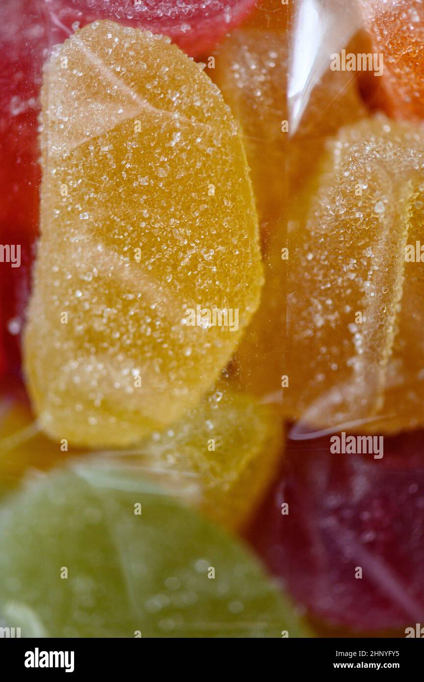 Sweet, colorful jelly fruits in transparent packaging invite you to ...
