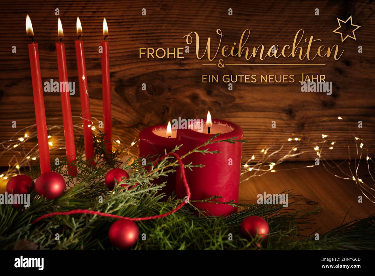 Christmas decoration with red advent candles and fresh green branches ...