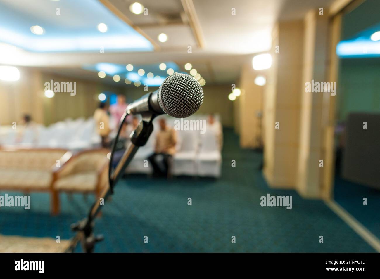 communication microphone on stage against a background of auditorium ...
