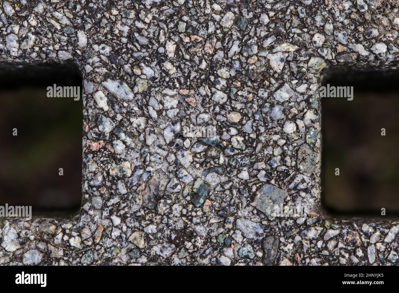 Detailed close up view on pebbles and stones on a gravel ground texture ...