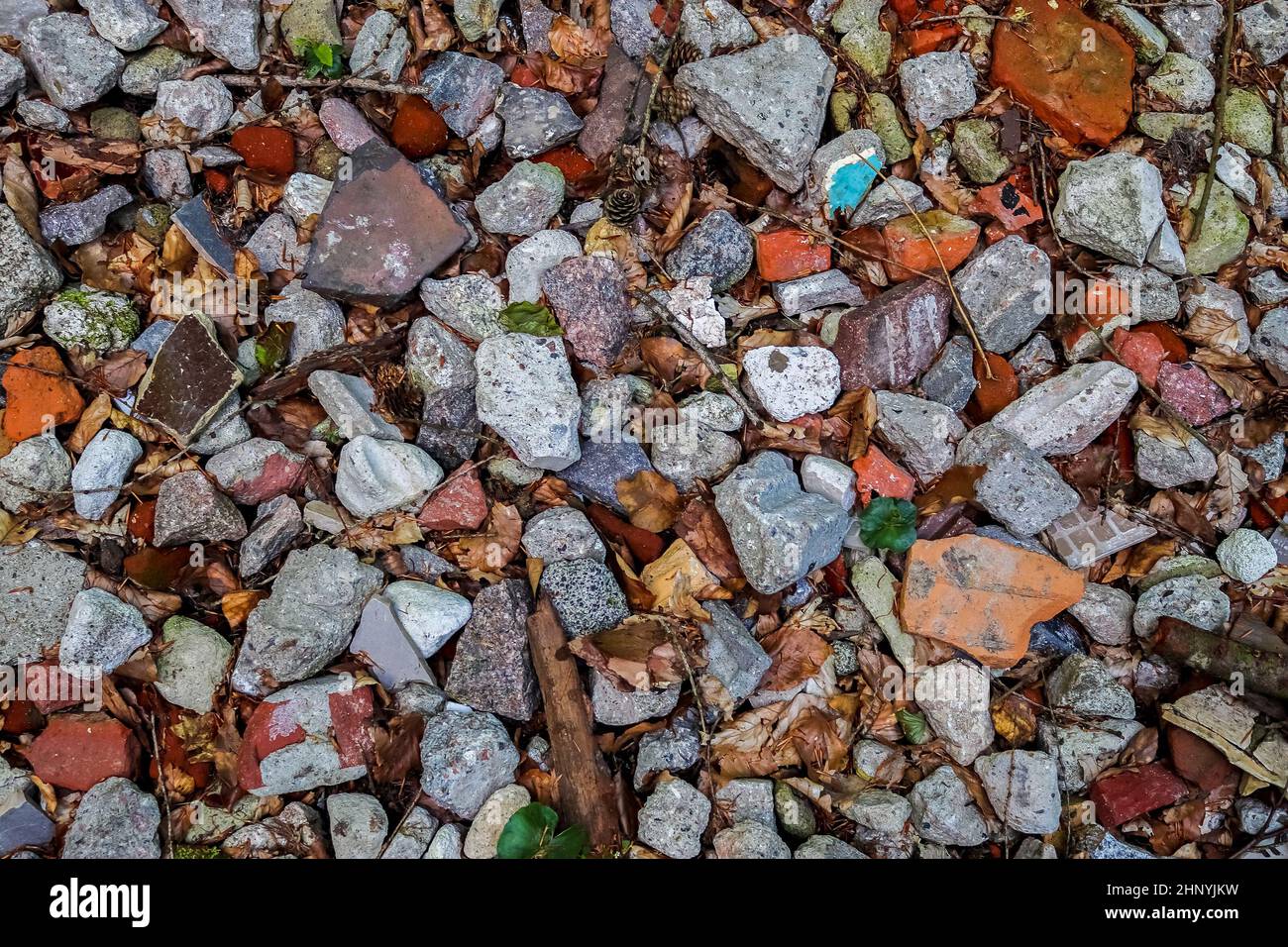 Detailed close up view on pebbles and stones on a gravel ground texture ...