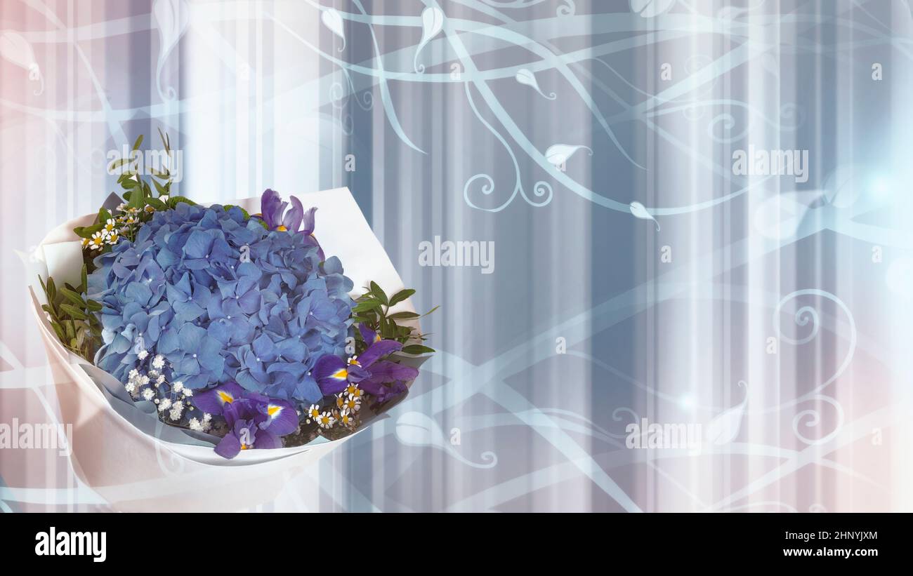 Blue hydrangea flowers in a beautifully designed bouquet on a light ...