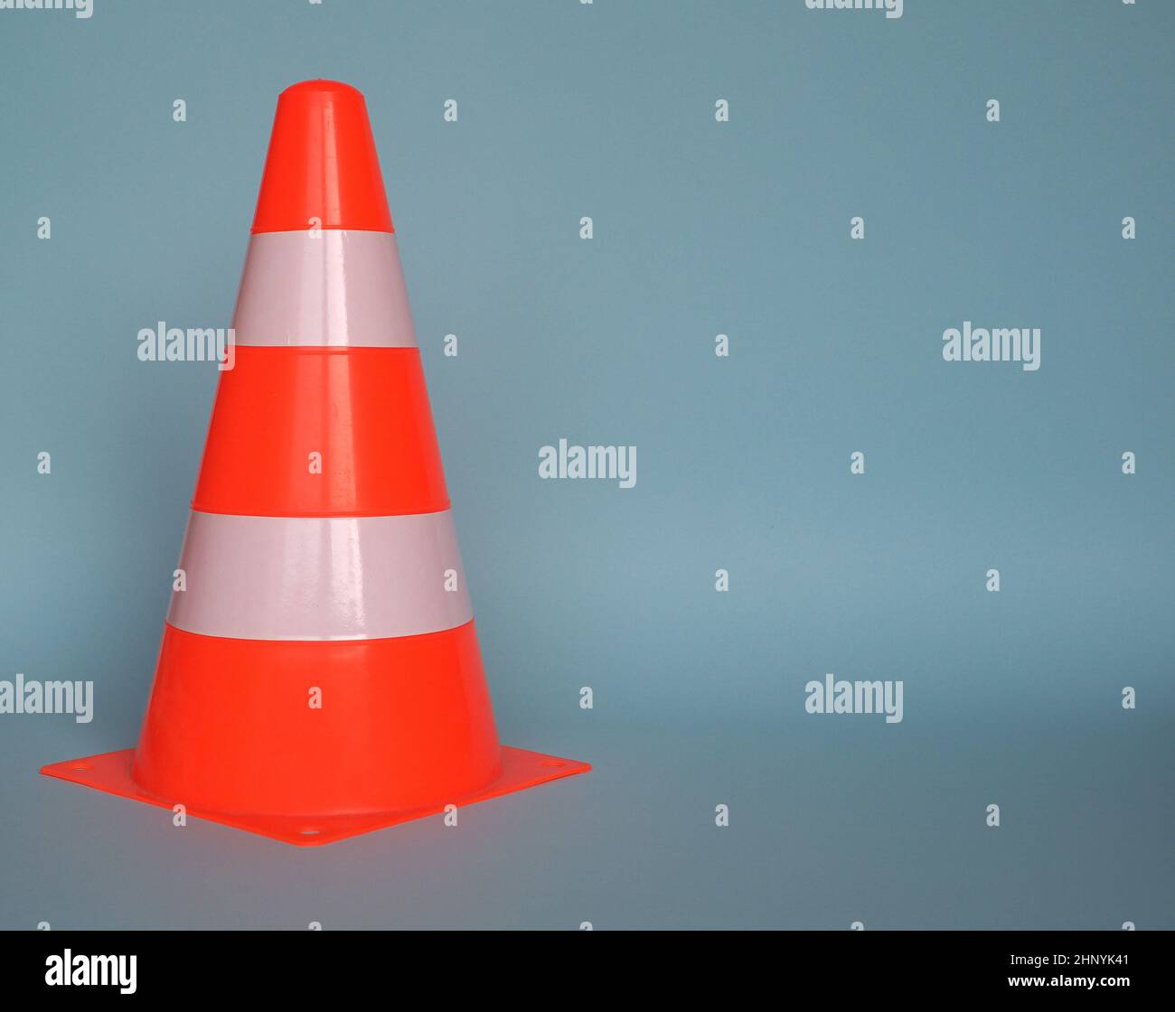 traffic cone to mark road works or temporary obstruction traffic sign ...