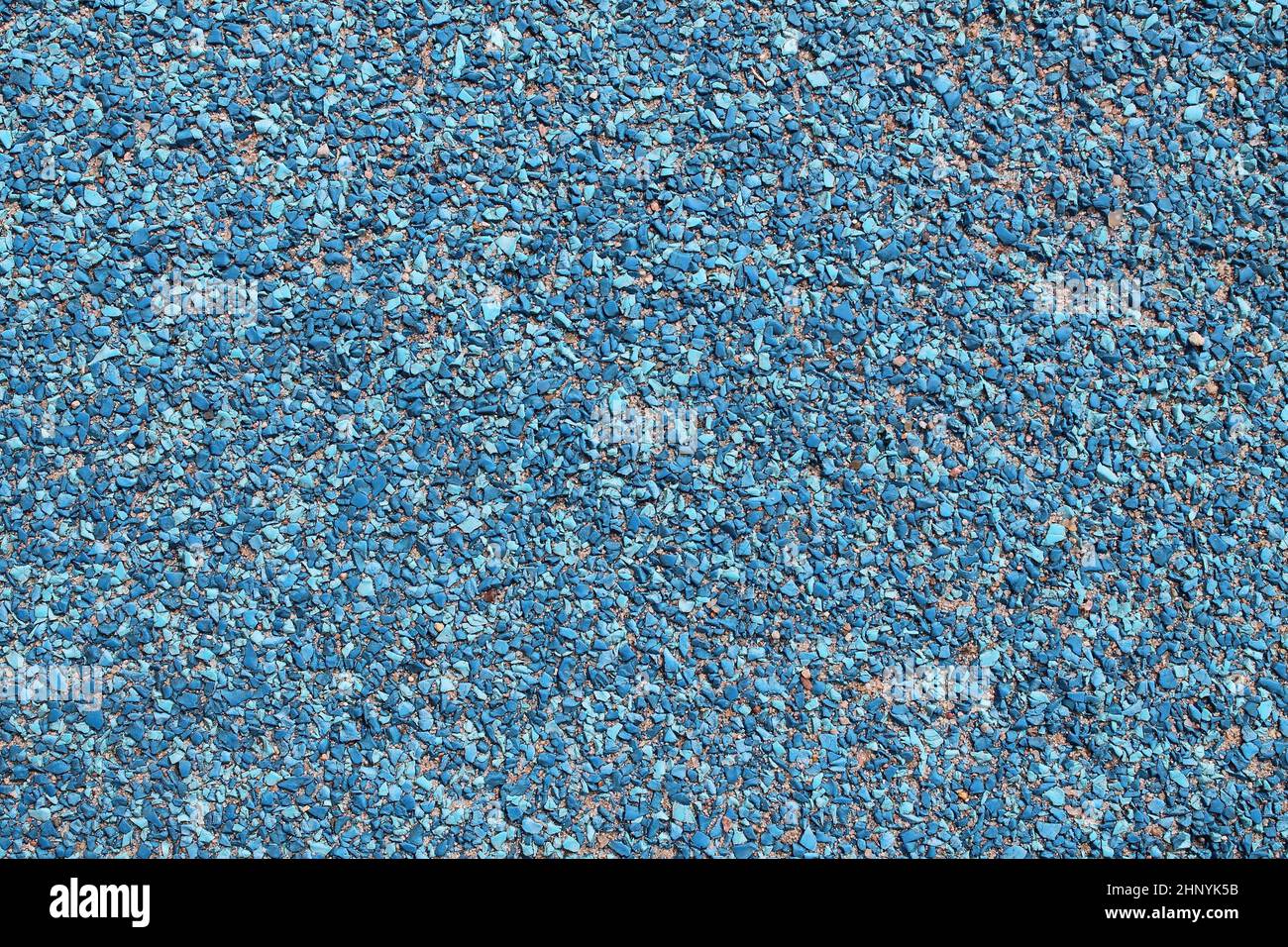 Detailed close up view on pebbles and stones on a gravel ground texture ...