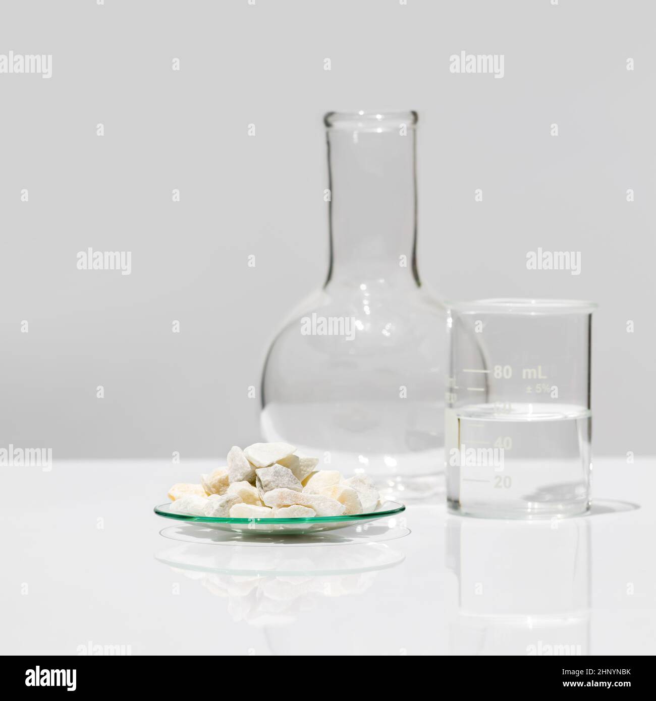 Calcium carbonate Chip in Chemical Watch Glass place next to crystal ...