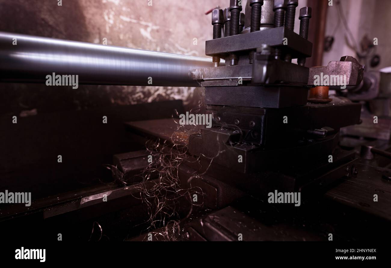 Lathe machine working in factory. Lathe turning machine for metalwork ...