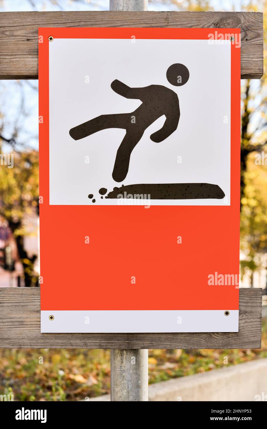 Road sign warns pedestrians about falling. Warning sign with falling ...