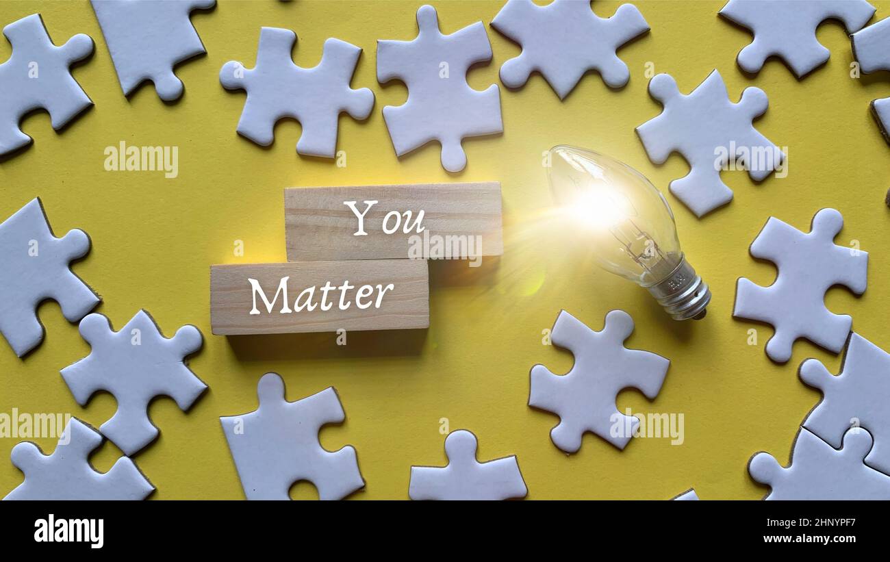 Top view of words - You matter with light bulb and jigsaw puzzle ...