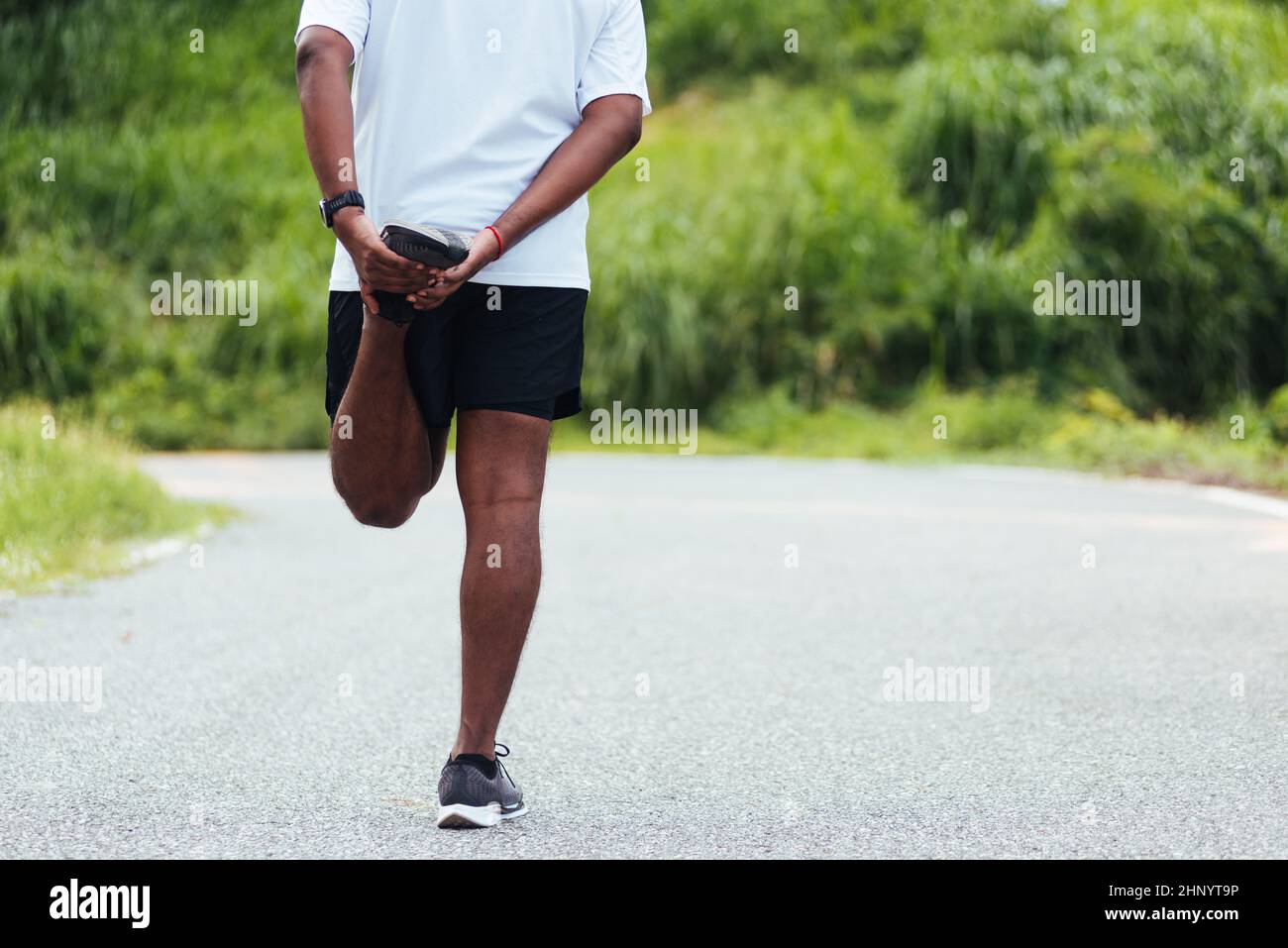 Close up Asian young athlete sport runner black man wear watch lift ...