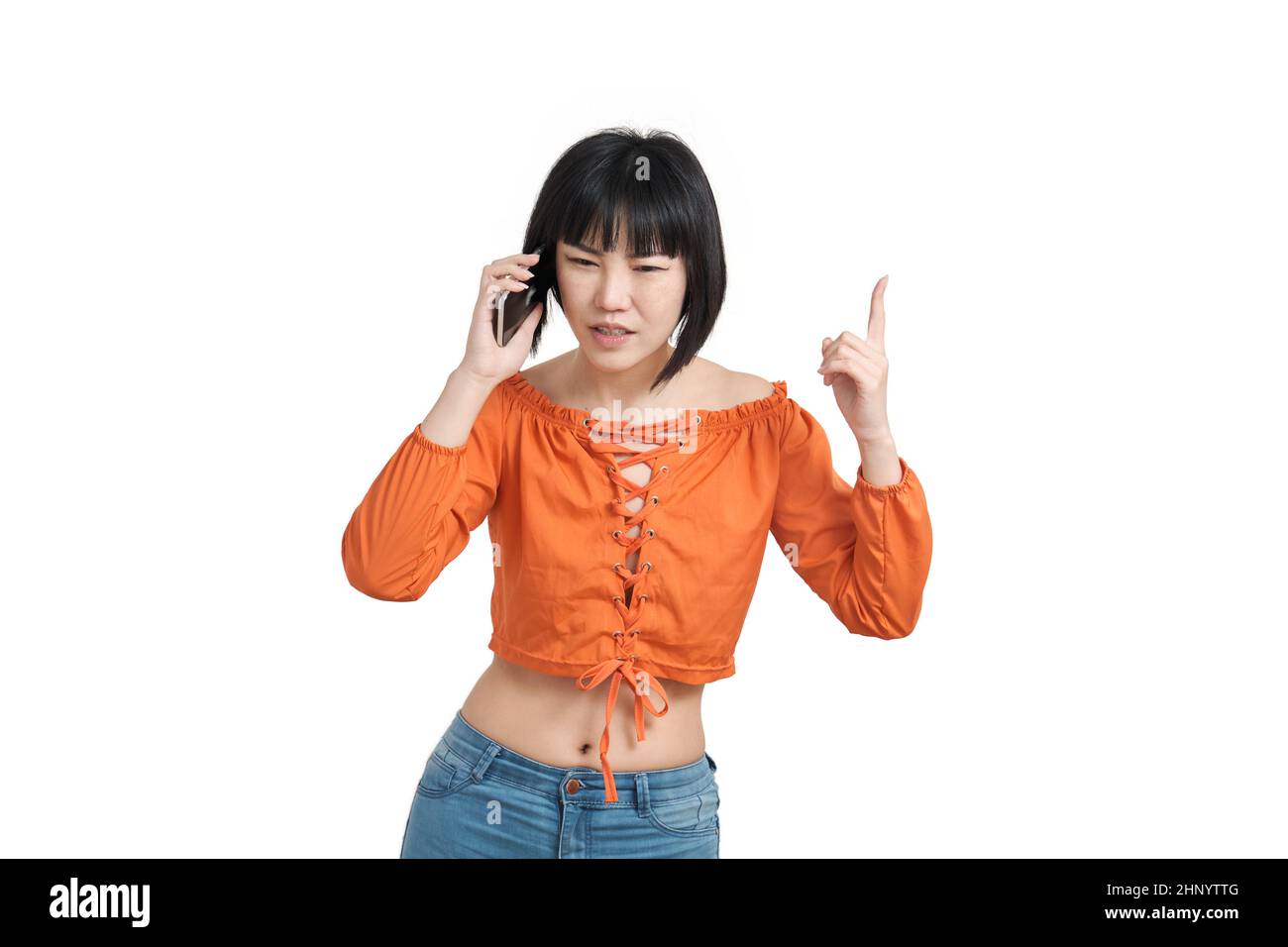 Young asian woman talking angrily on the smartphone, isolated Stock ...