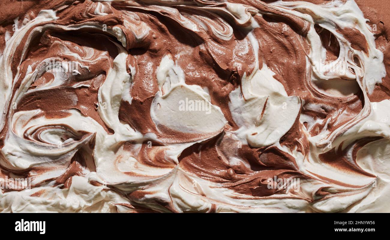 Dual flavour chocolate and vanilla ice-cream or gelato in a close up ...