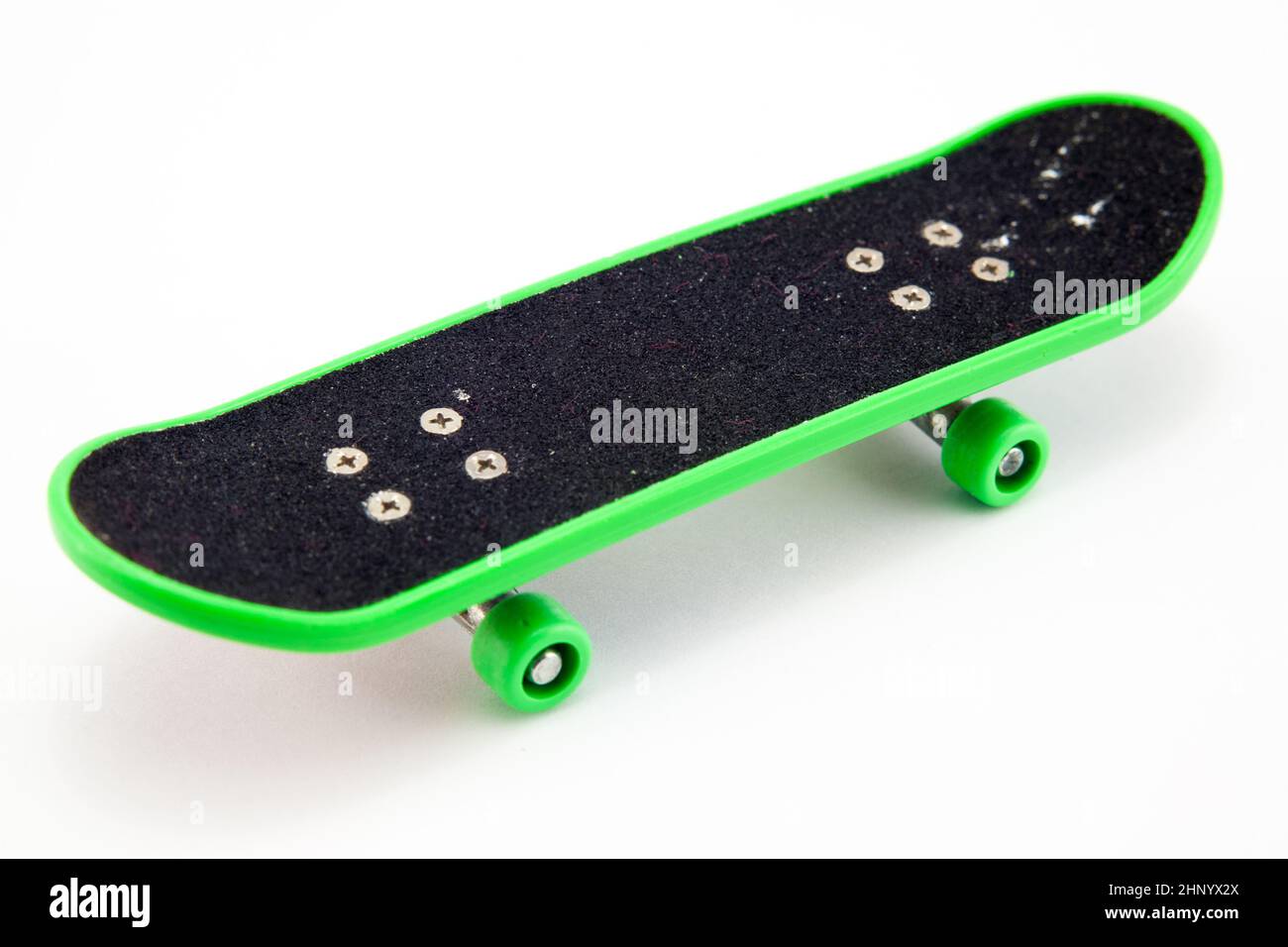 green skateboard isolated on wooden background. Stock images Stock ...