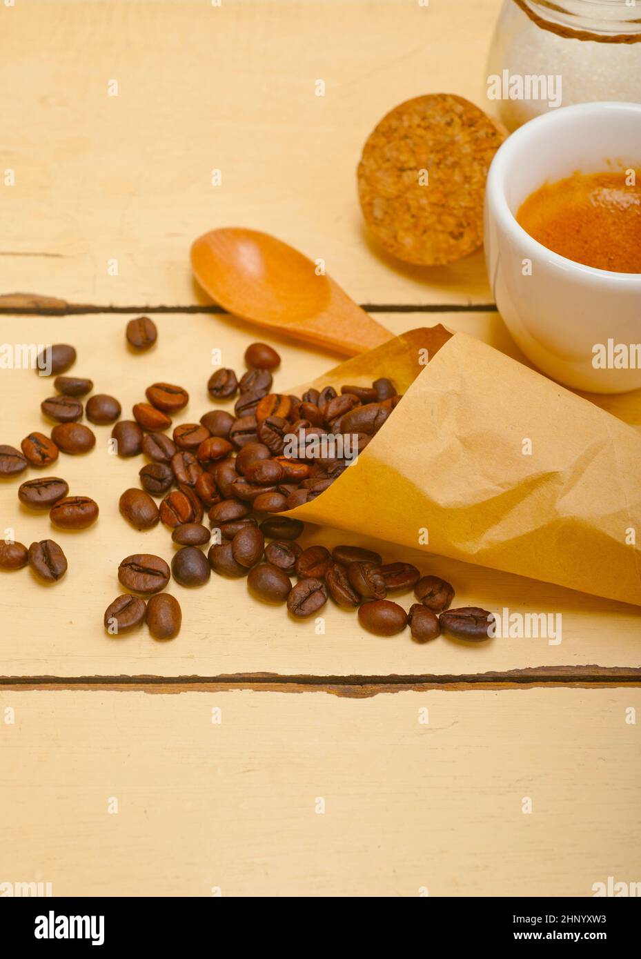 espresso coffee and beans on a paper cone cornucopia over white ...