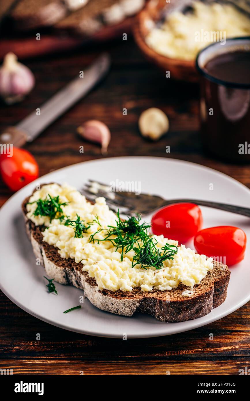 Rye bread toast with processed cheese, garlic and dill Stock Photo - Alamy