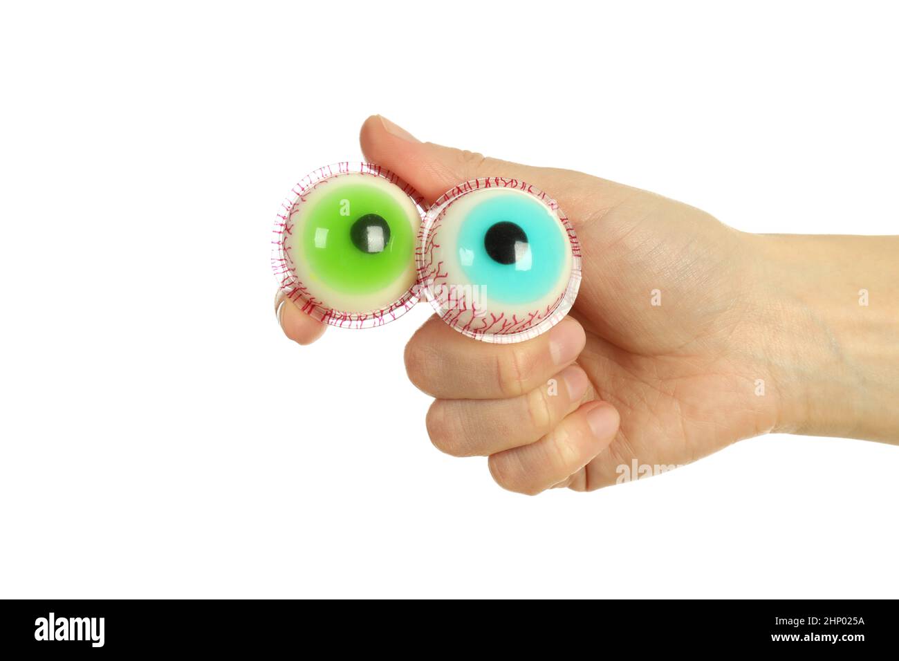 Female hand holds eye candies, isolated on white background Stock Photo ...