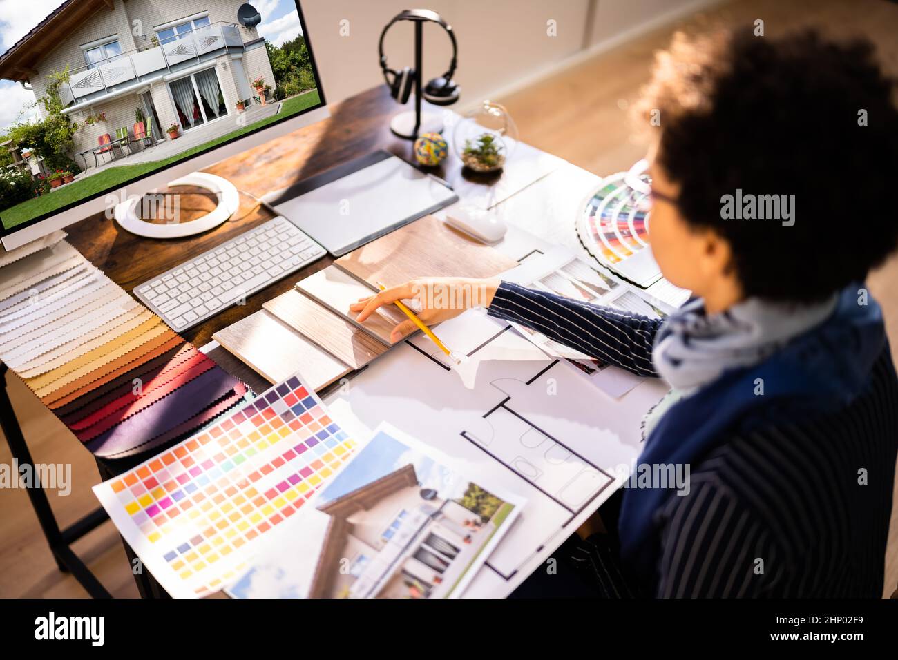 Side View Of Real Estate Designer Working On Computer In Office Stock ...