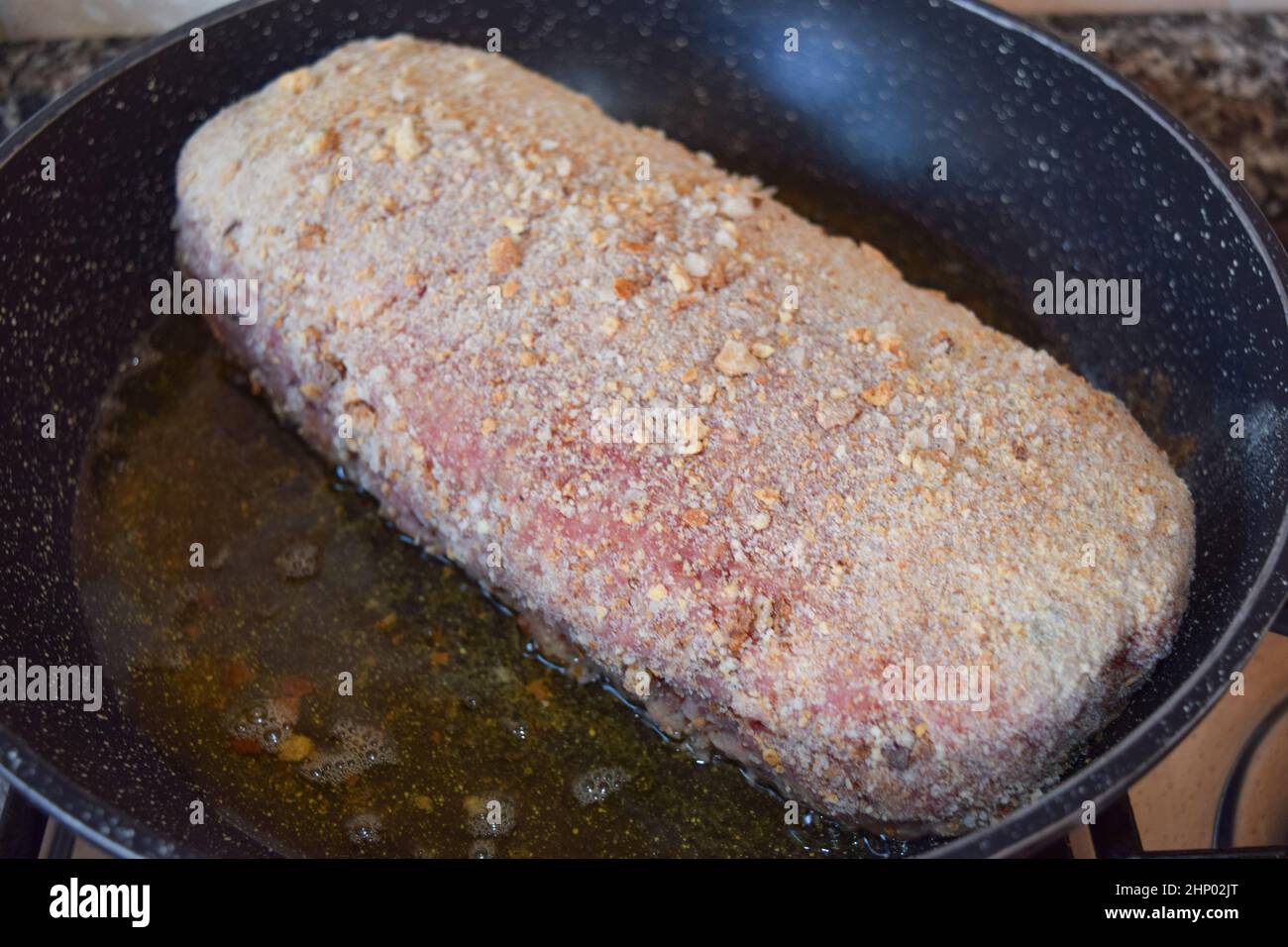 meatloaf being cooked in a stir-fried Stock Photo - Alamy