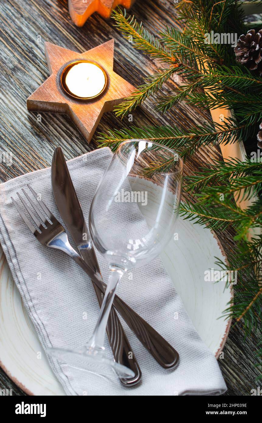 Christmas table setting for dinner. Festive composition with candles ...