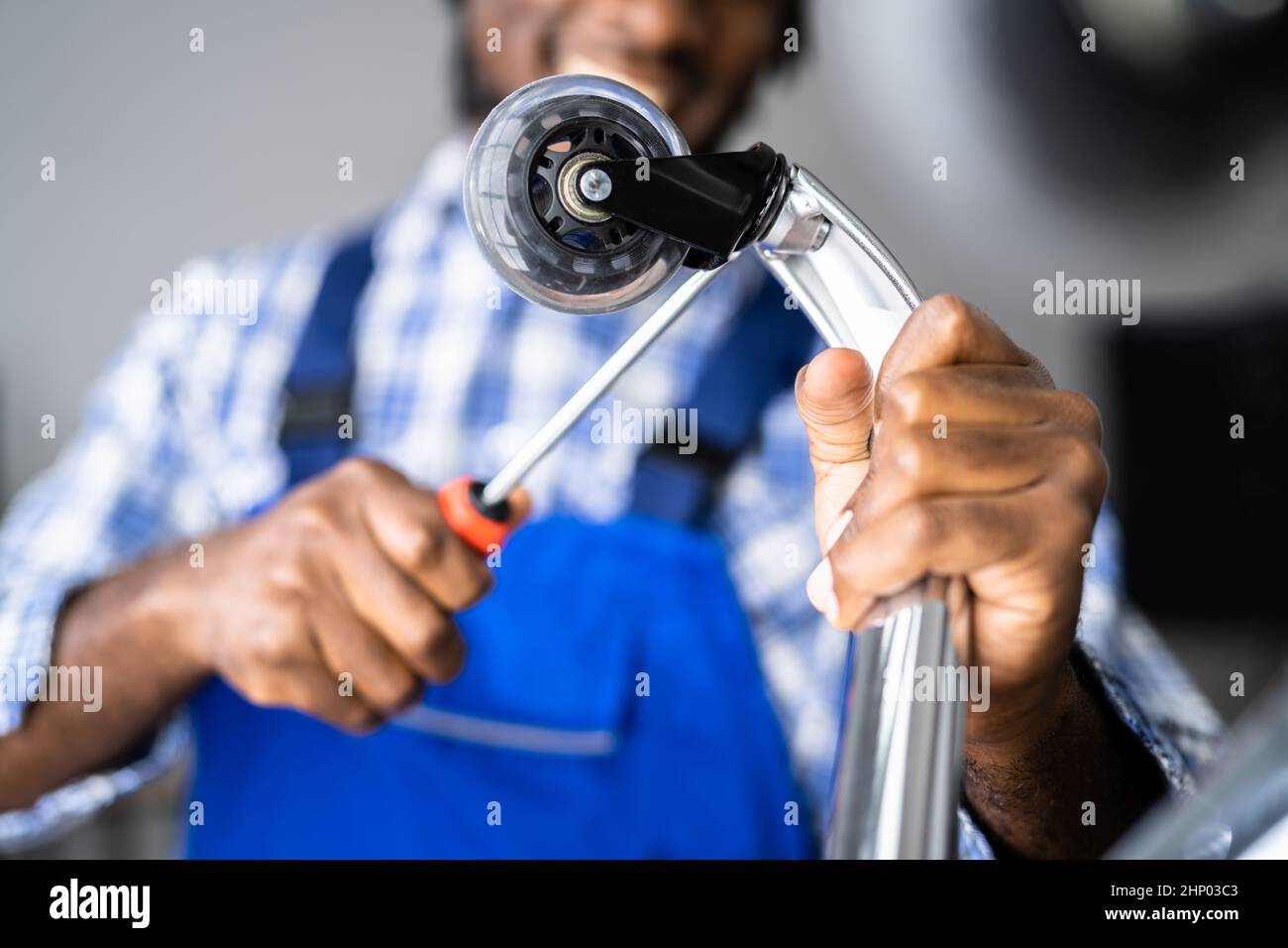 Office Chair Assembling And Repair. Man Working With Tool Stock Photo ...