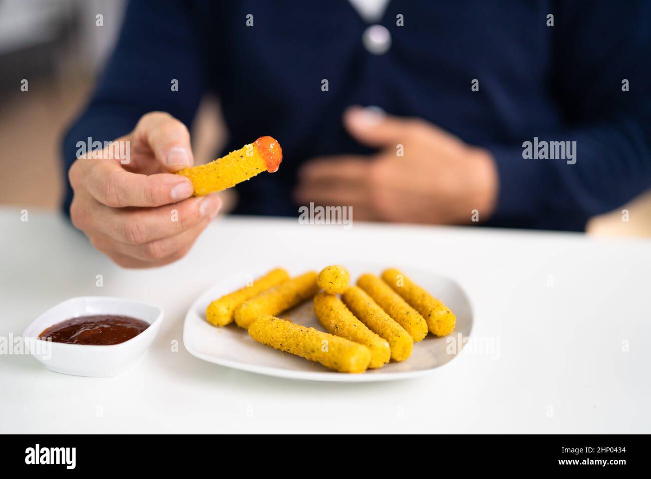 Heartburn Sick And Stomach Pain. Avoid Eating Fast Food Stock Photo - Alamy