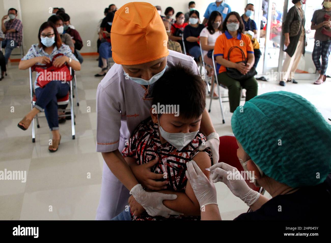 Surakarta, Indonesia. 18th Feb, 2022. A medical worker administers a ...