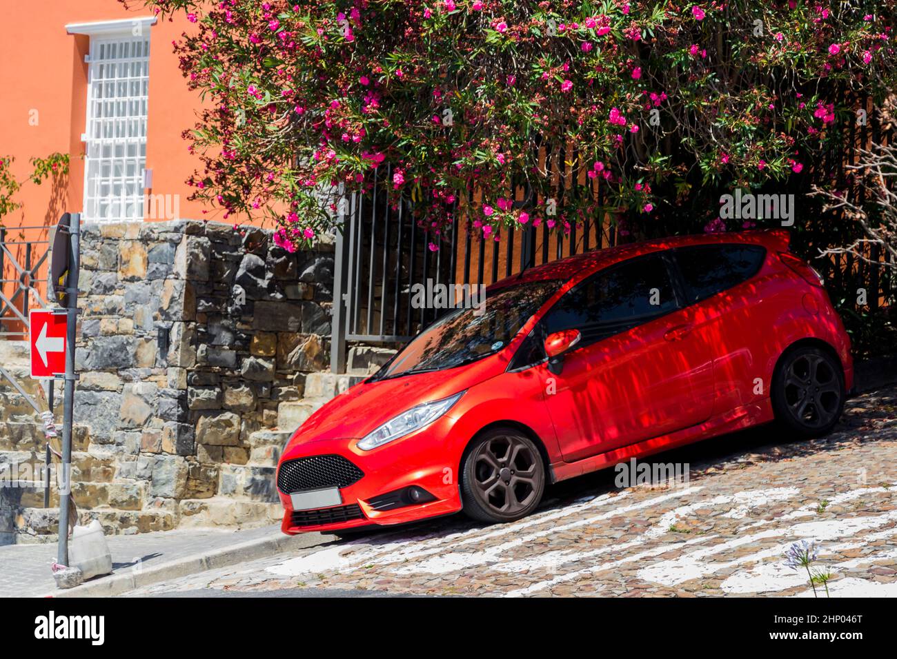 Red slanted sports car in the Bo-Kaap district, Cape Town, South Africa ...
