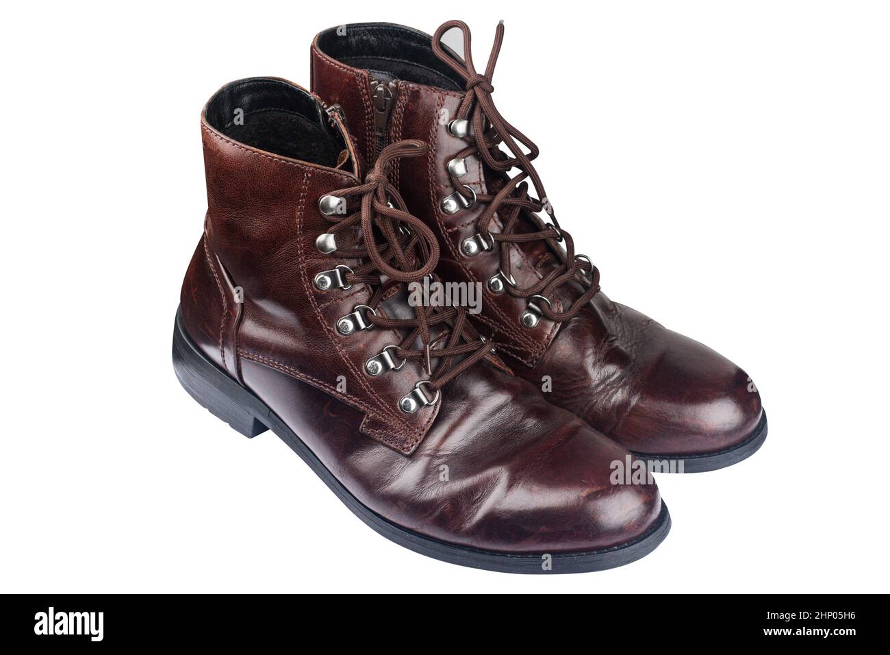 side view closeup of a pair of polished vintage brown leather boots ...