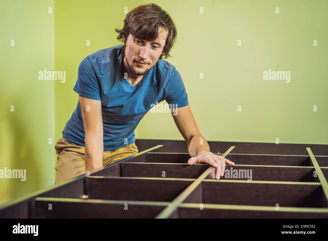Frustrated Man Putting Together Self Assembly Furniture Stock Photo - Alamy