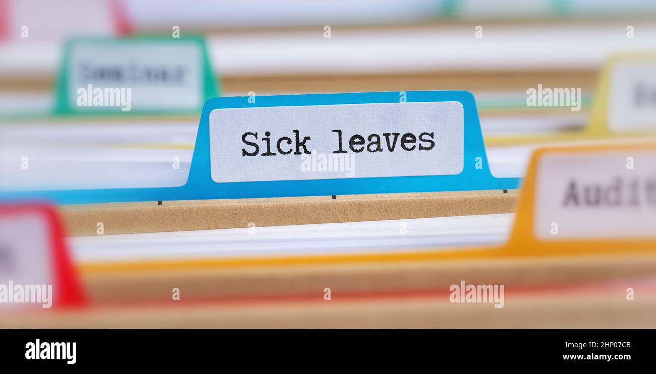 File folders with a tab labeled Sick Leaves Stock Photo - Alamy