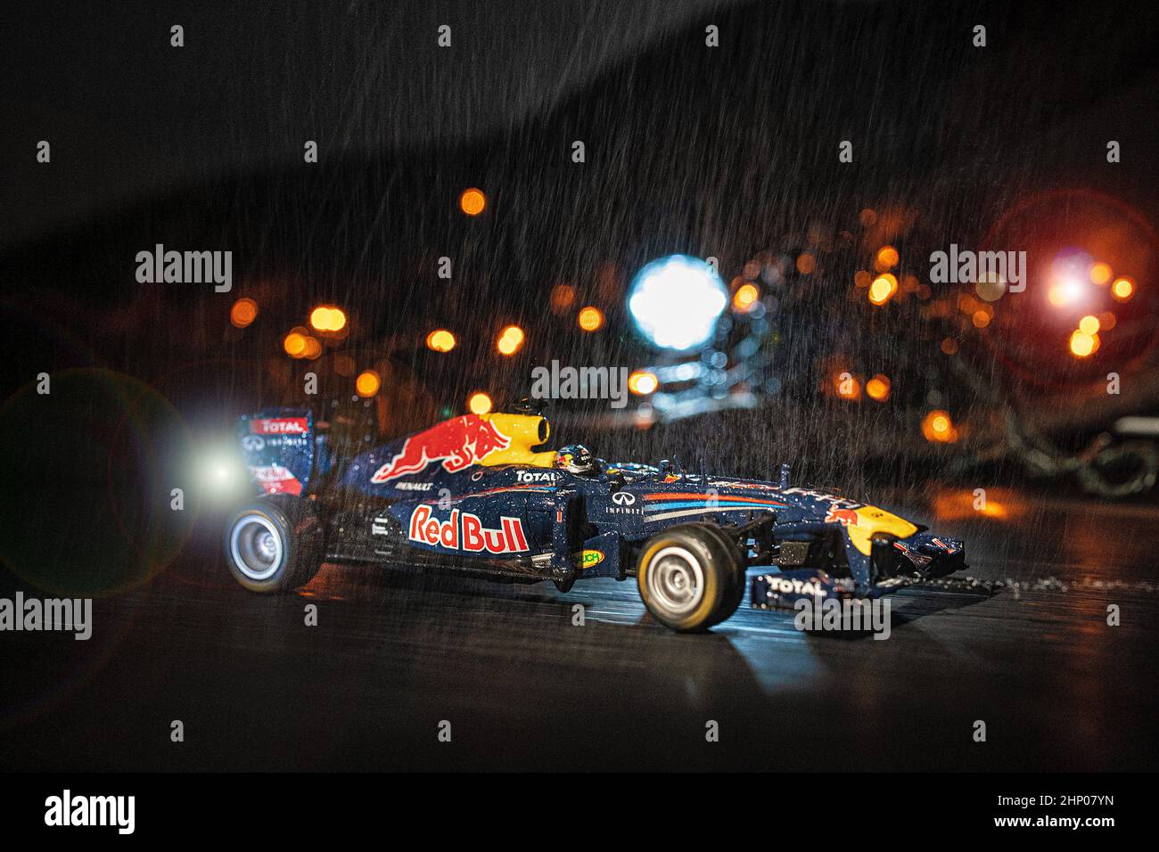 Image of a Formula 1 Red Bull in action with rain and backlights Stock ...