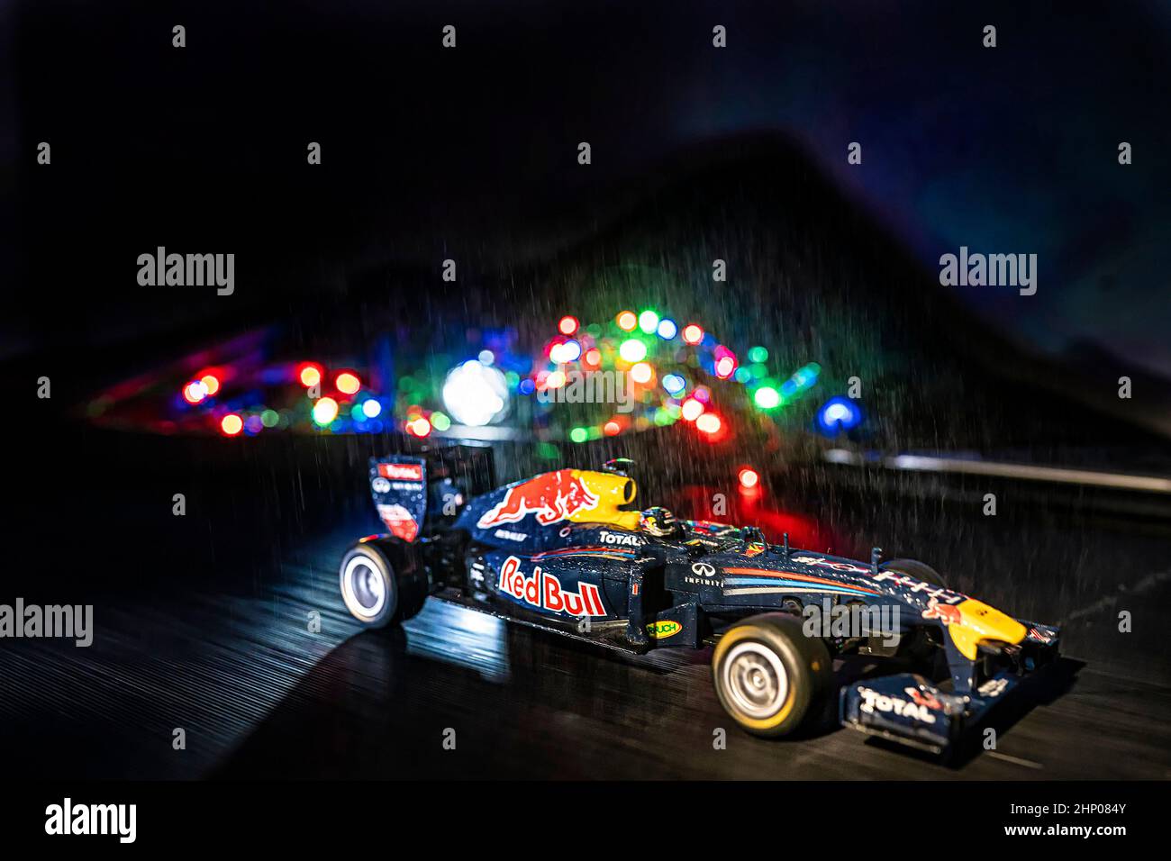 Image of a Formula 1 Red Bull in action with rain and backlights Stock ...