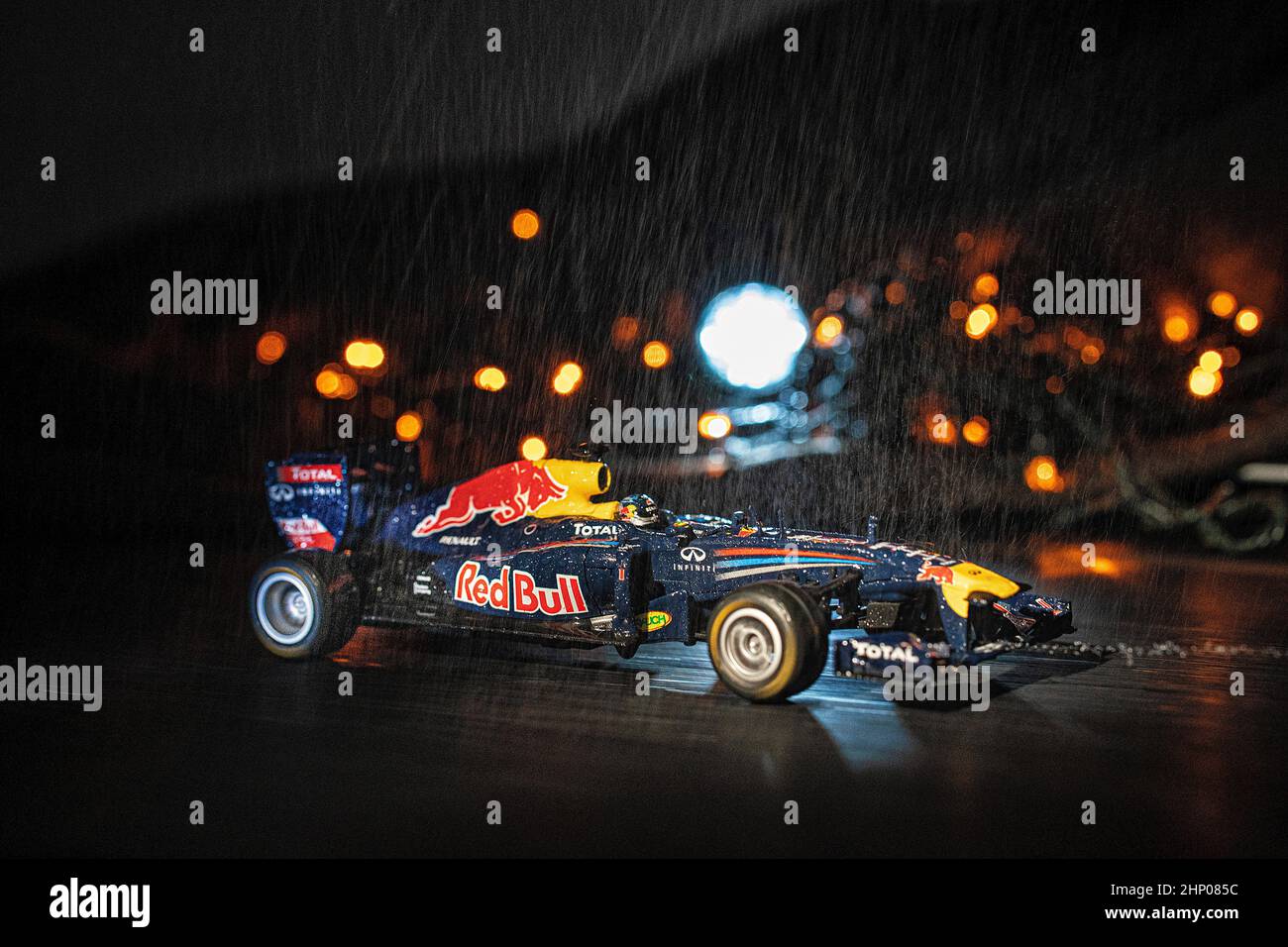 Image of a Formula 1 Red Bull in action with rain and backlights Stock ...