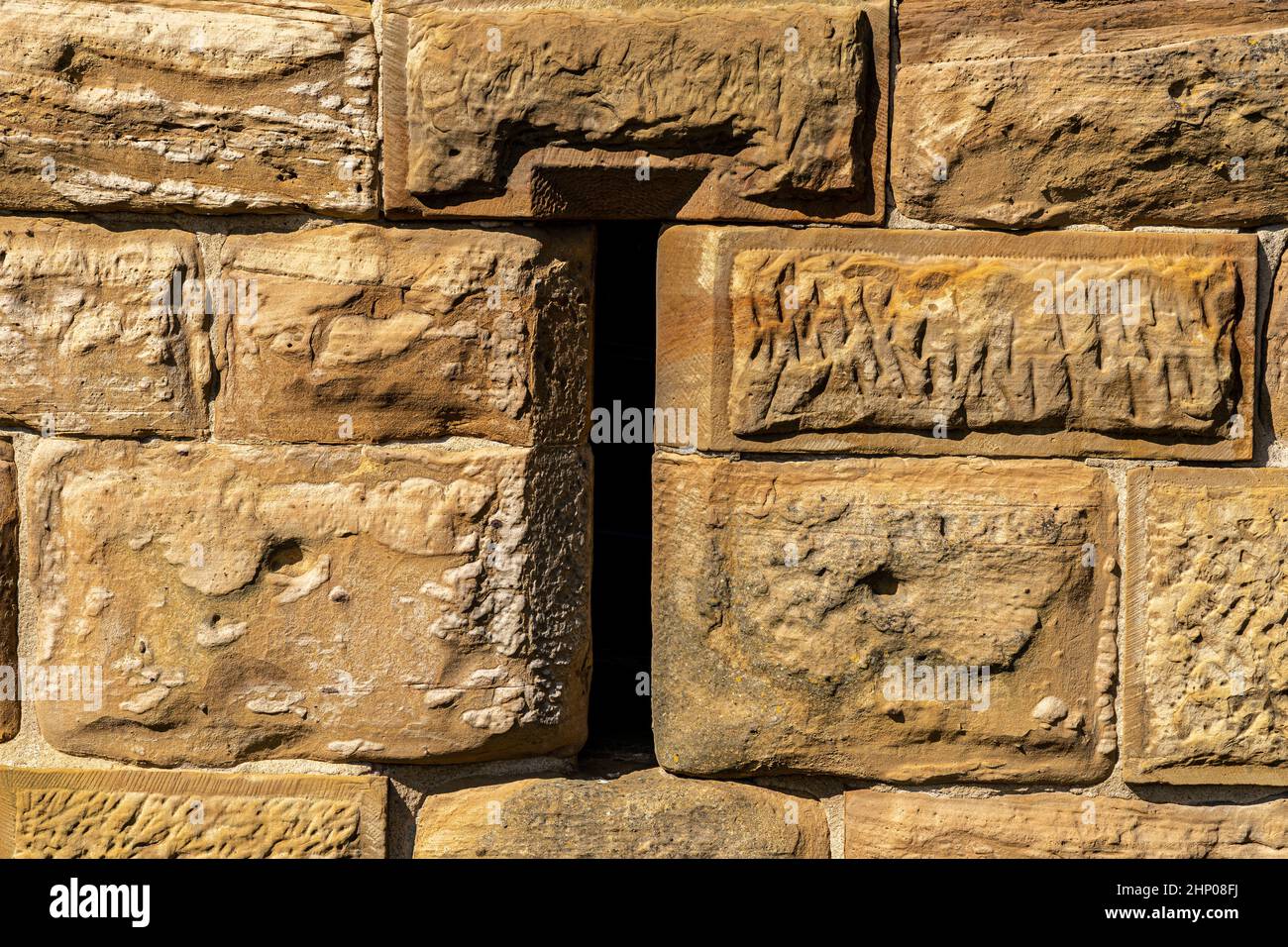 Embrasure inside of the massive high walls of an old medieval castle ...