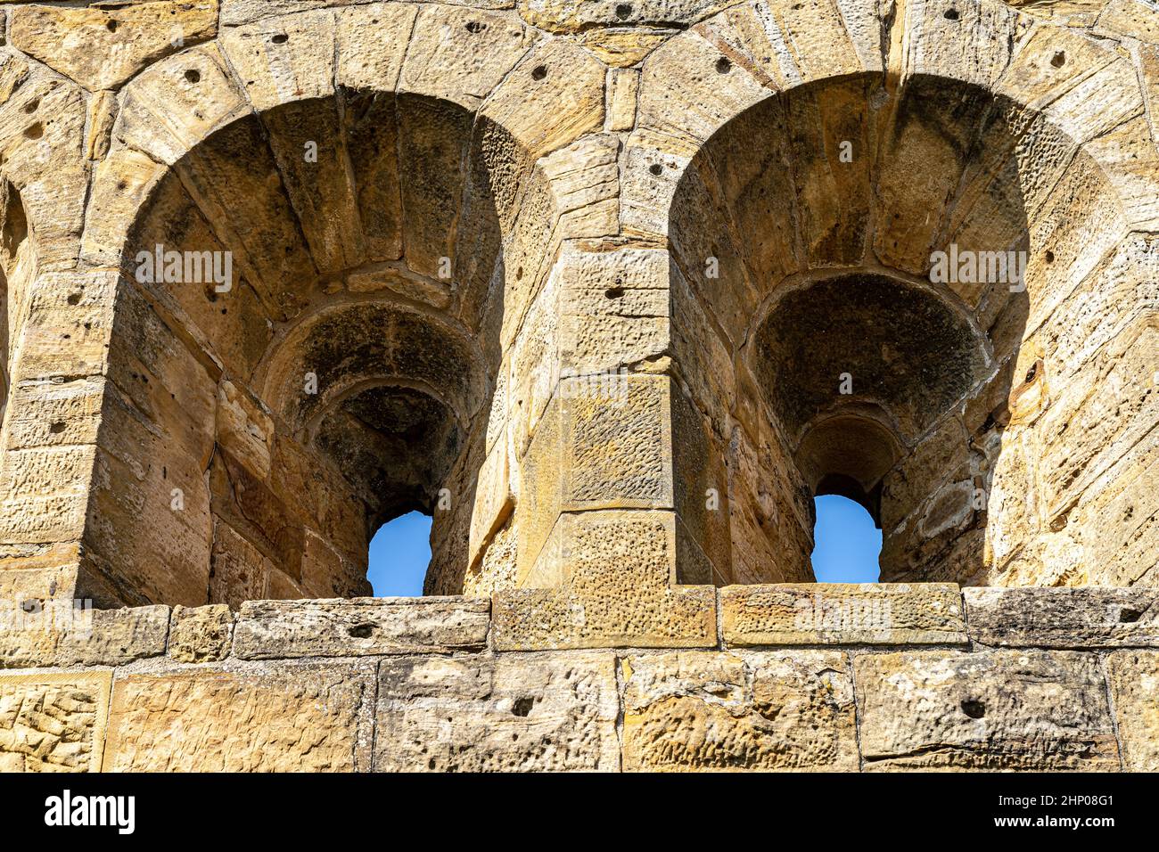 Windows inside of the massive high walls of an old medieval castle ...