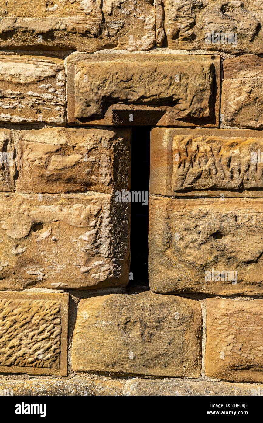 Embrasure inside of the massive high walls of an old medieval castle ...