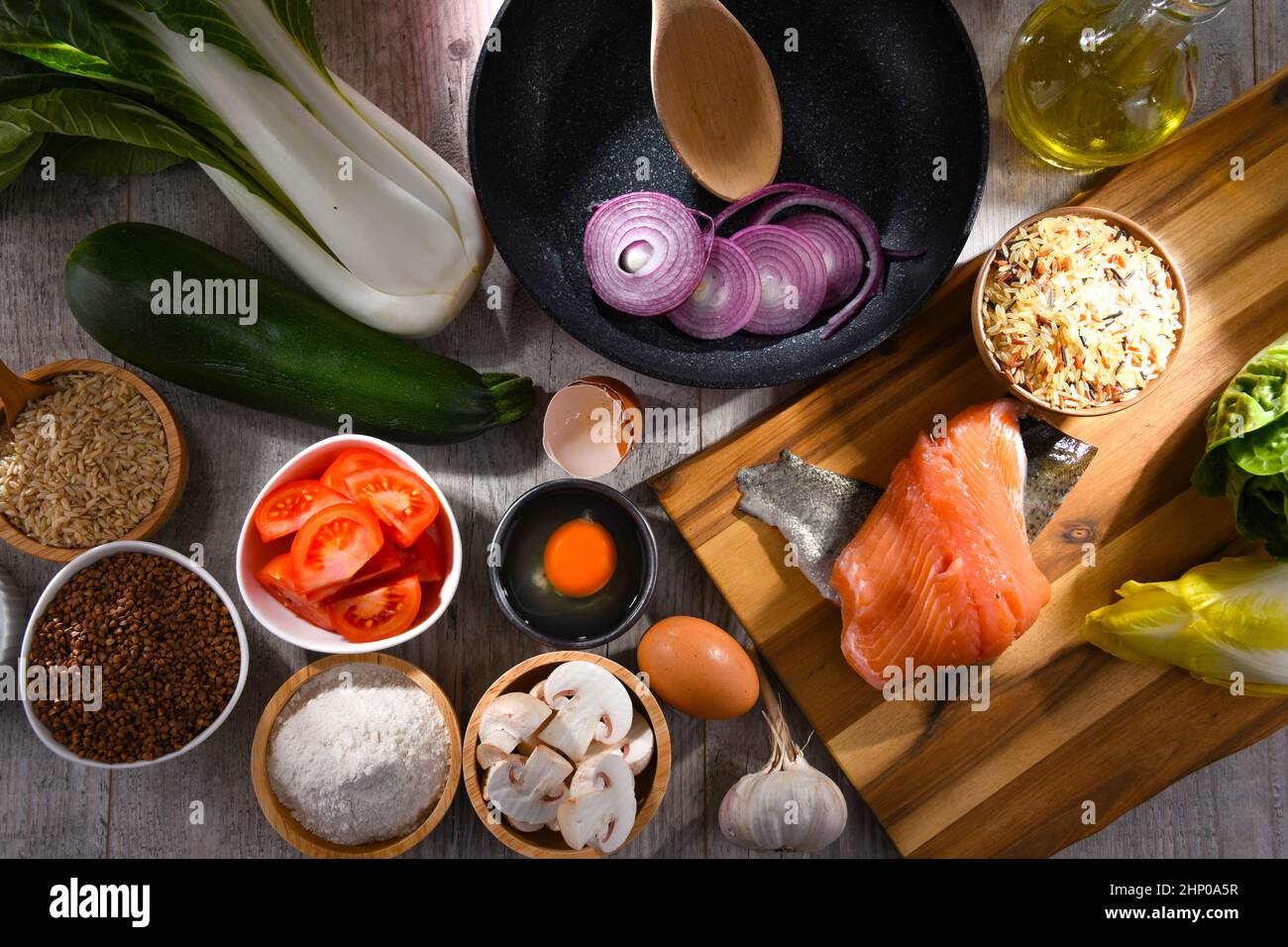 Fresh food ingredients prepared for cooking on a kitchen table Stock ...