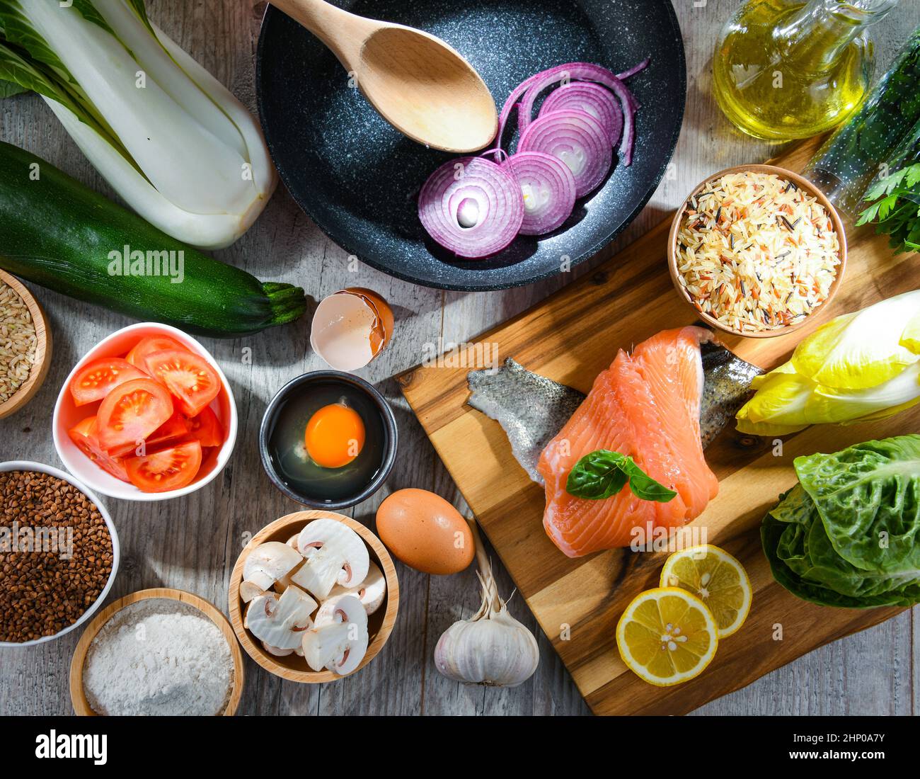 Fresh food ingredients prepared for cooking on a kitchen table Stock ...