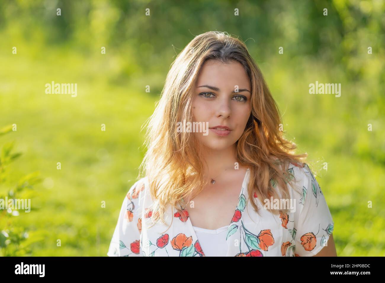 Atractive beautiful young woman is posing outdoors. Horizontally Stock ...