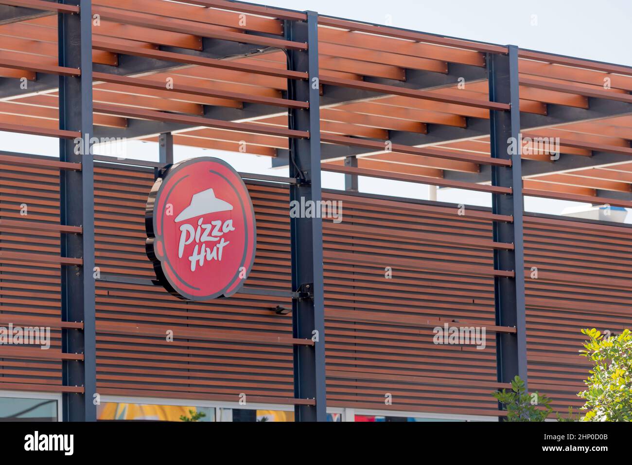 The brand name Pizza Hut in white on a red background on the exterior ...