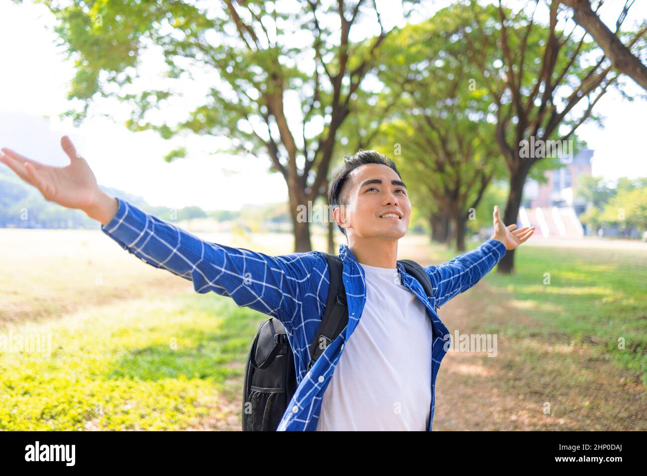 Happy man breathing deeply fresh air in a forest with green trees Stock ...