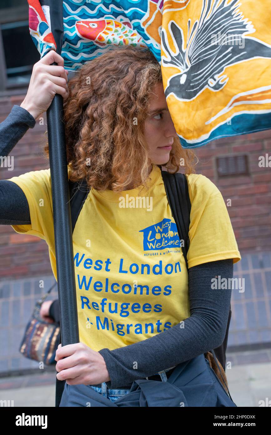 London, UK. 23rd October 2021. Flag bear with Little Amal, the giant ...
