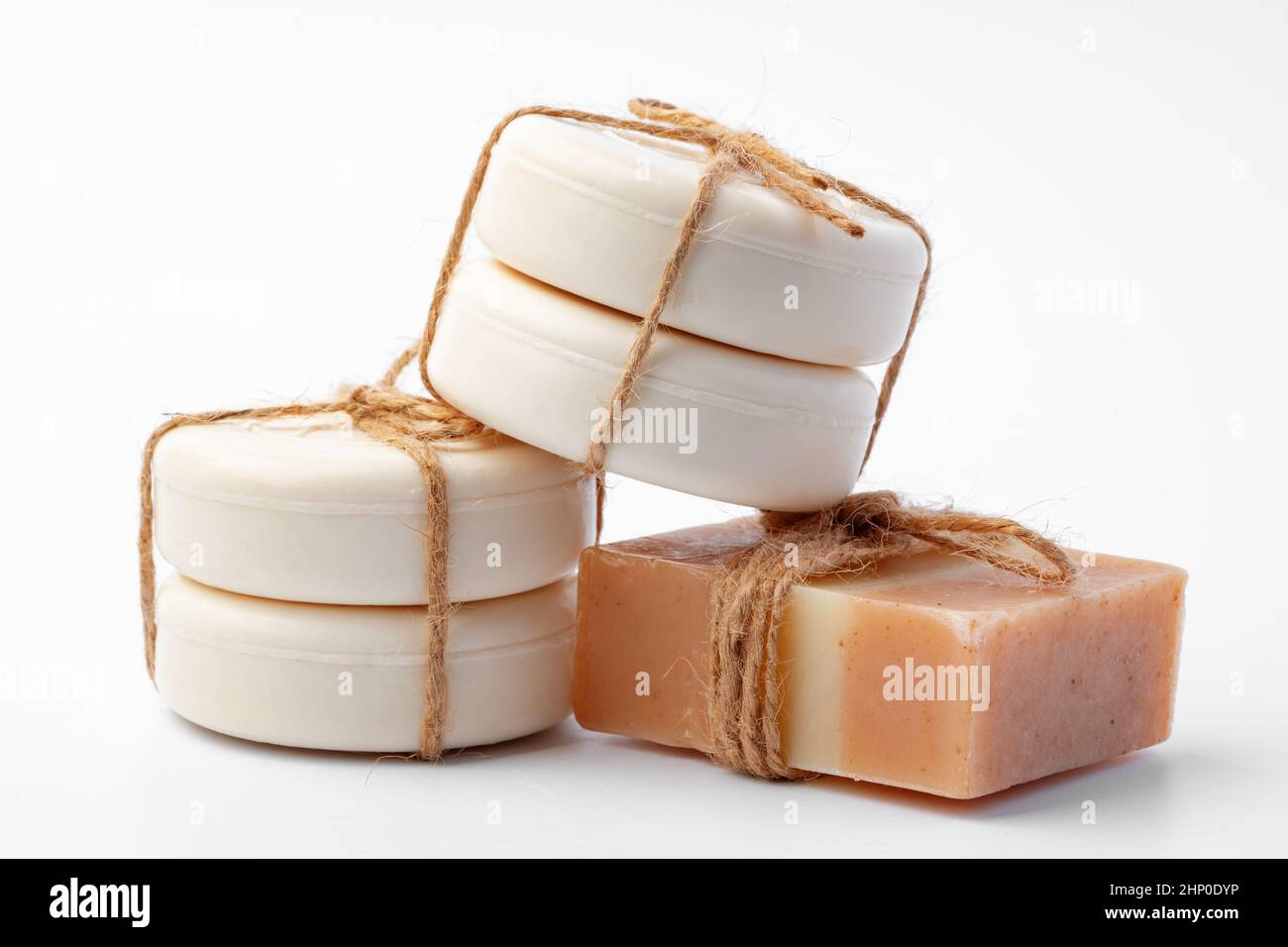 Soap bars tied with twine on white background Stock Photo - Alamy